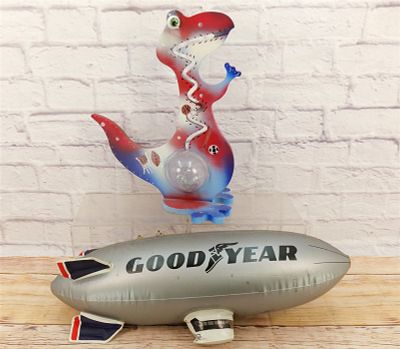 Lot 90 - Inflatable Goodyear Blimp and Wooden hand-painted dinosaur ...
