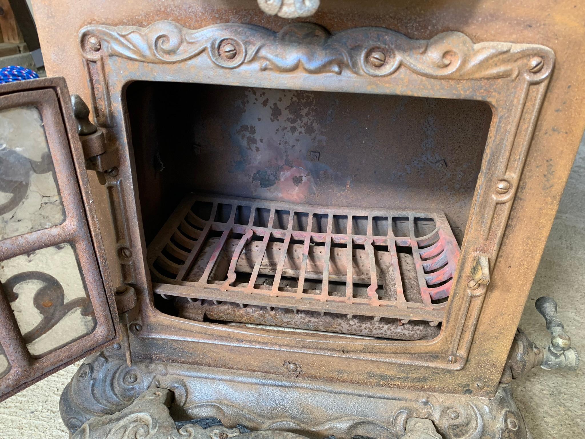 Lot 143 - Antique Quad Parlor Cook Stove Cast Iron with Ornate Design ...