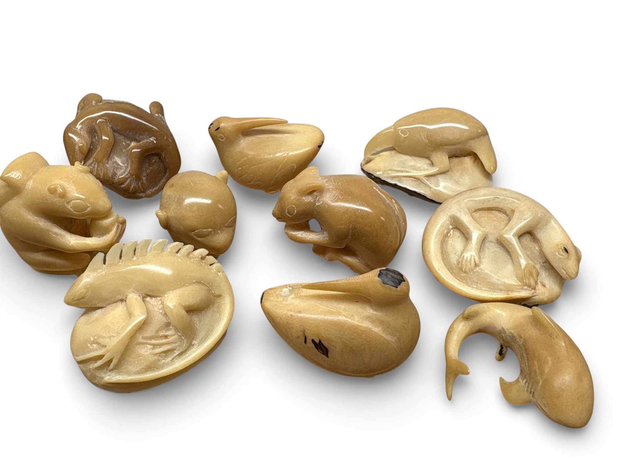 Lot 5434 - A Collection of Japanese Carved Tagua Nut okimono Figures ...