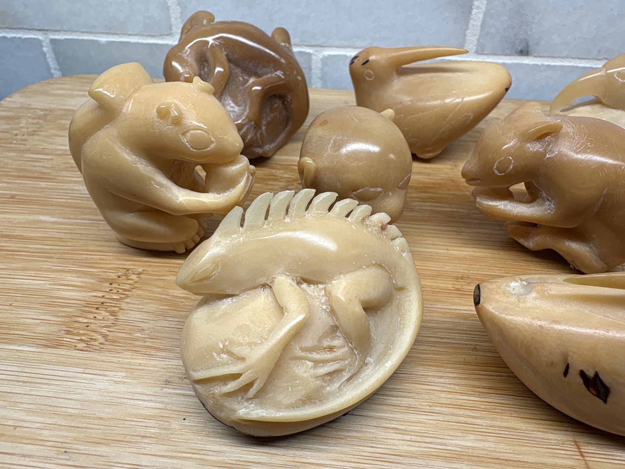 Lot 5434 - A Collection of Japanese Carved Tagua Nut okimono Figures ...