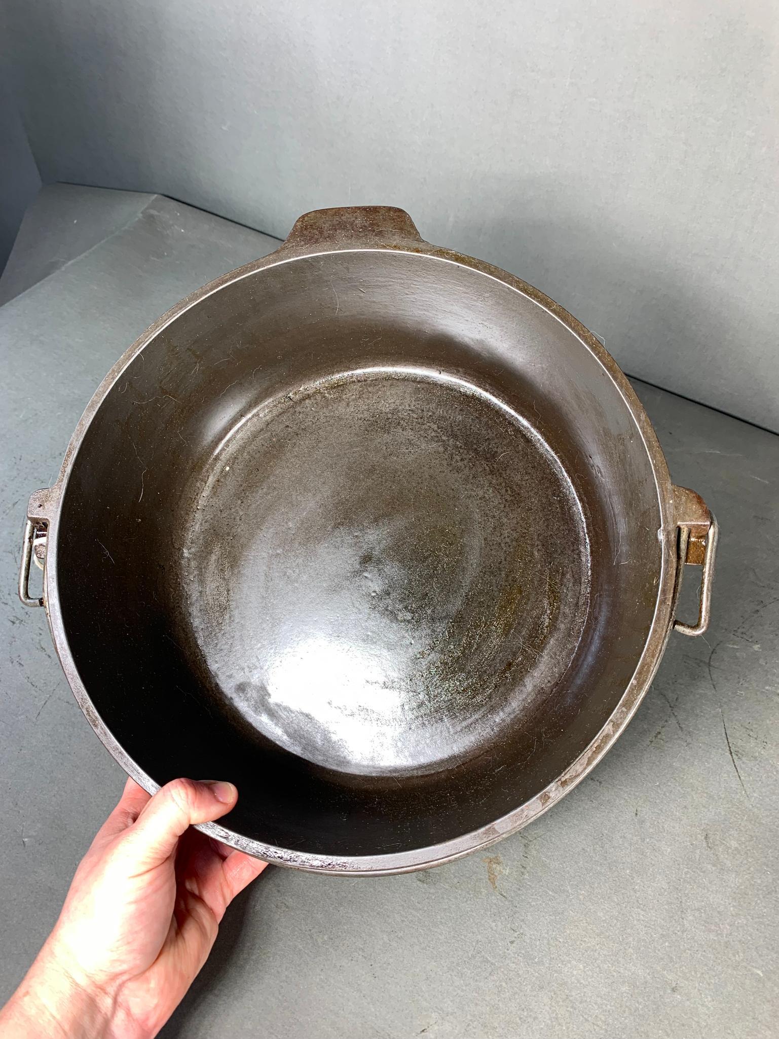 Lot 5954 - Vintage Lodge Cast Iron Split Bail Dutch Oven with High Dome ...