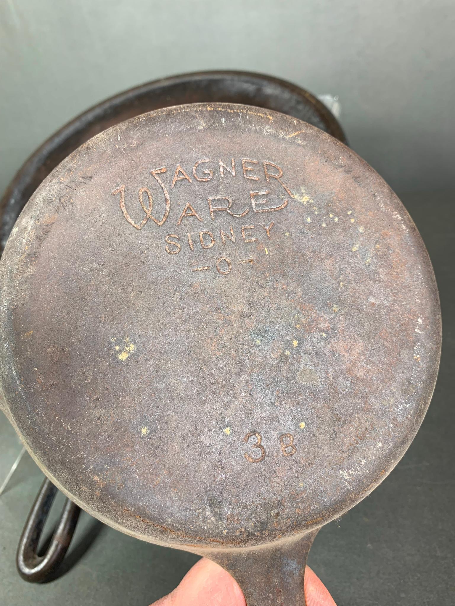 Lot 7194 - A Trio of Wagner Ware and Griswold Cast Iron Cookware ...