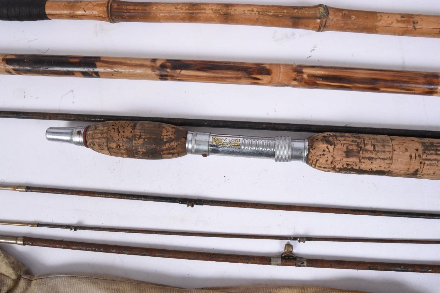 Lot 118 - VINTAGE BAMBOO AND METAL FISHING ROD | Chapel Street Auctions
