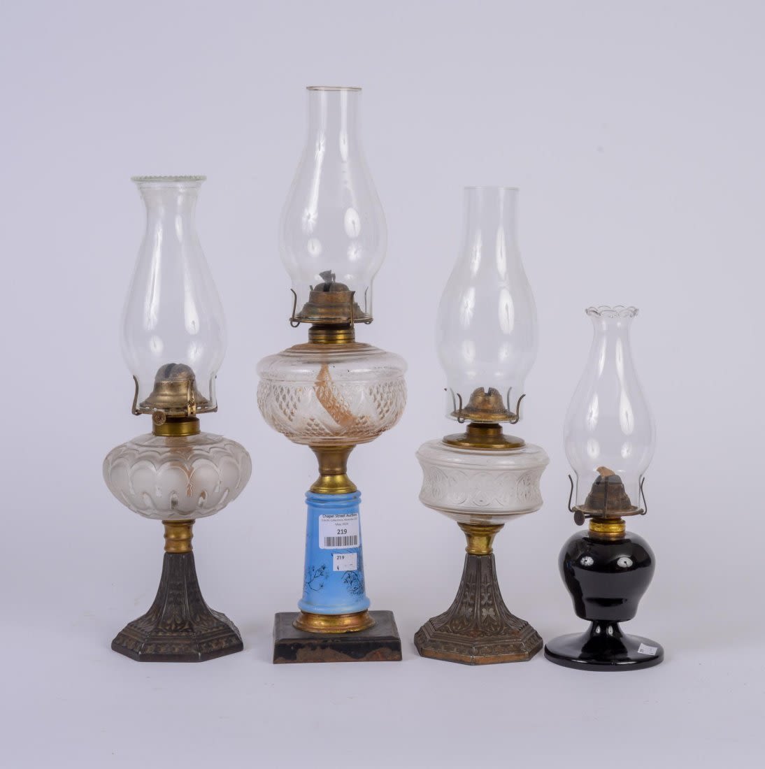 Lot 219 - Group of Four Cast Iron and Ceramic Oil Lamps | Chapel Street ...