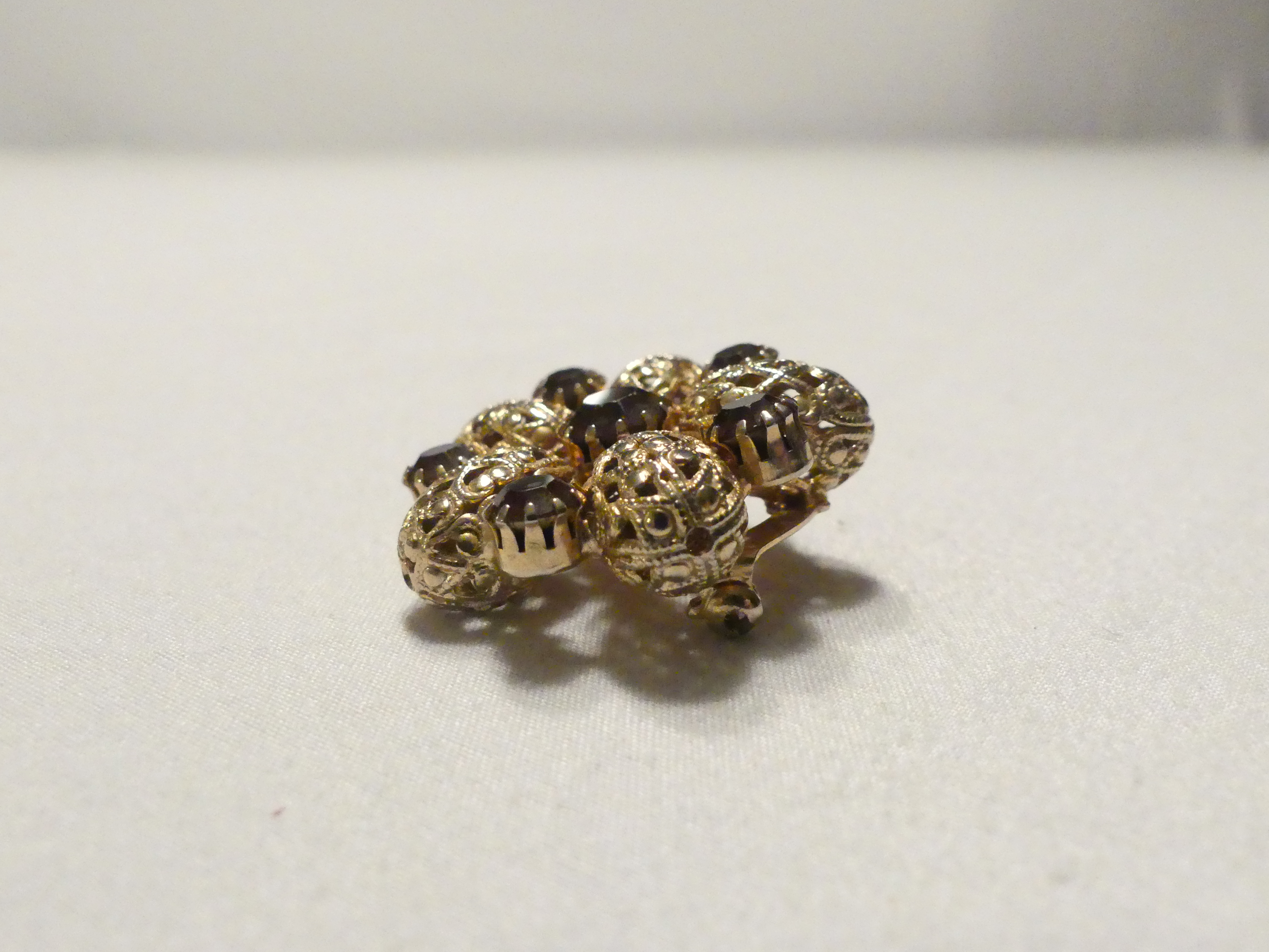 Lot 330 - Vintage Gold Tone Fret Work Flower Brooch with Amber Stones ...