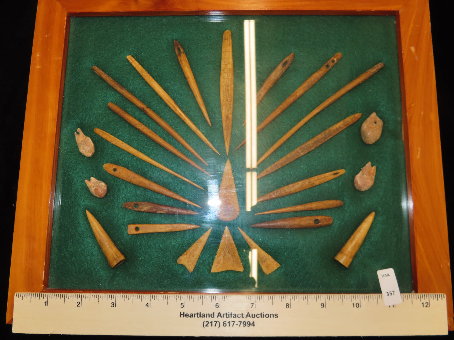 Lot 357 - Frame of Mandan Bone Needles/Awls, Tooth Pendants, and Points ...