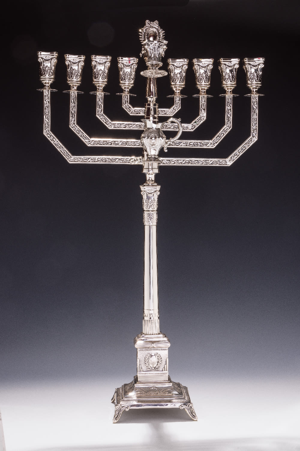 Lot 206 – A LARGE SILVER HANUKKAH MENORAH. Warsaw, c.1900. On an ...