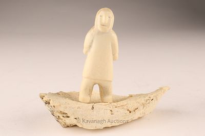 Lot 71 - Inuit Carved Bone Figure on Driftwood Base - Kavanagh Auctions