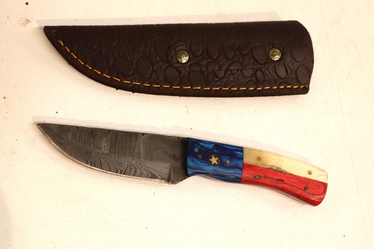 Lot 224 - Damascus knife with red white blue handle leather sheath ...
