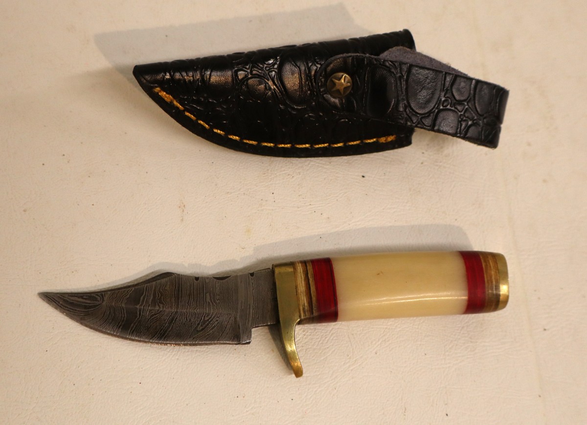 Lot 234 - Damascus knife with bone style handle and leather sheath ...