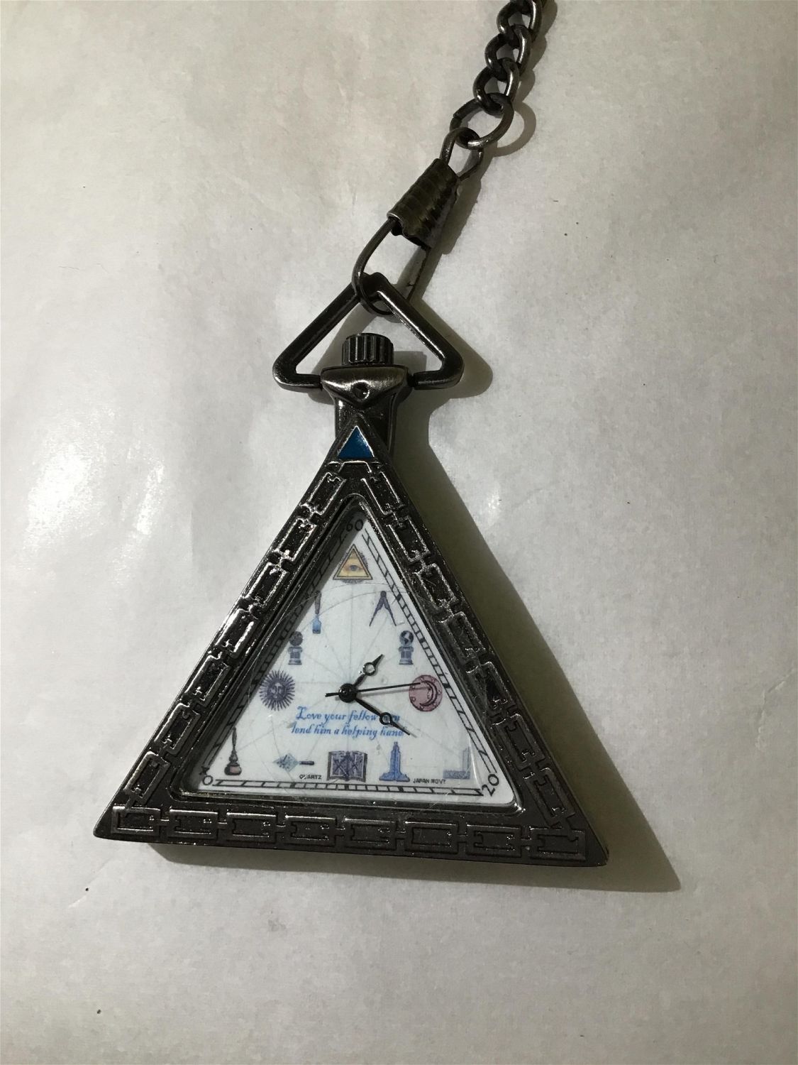 Lot 124 - Vintage Quartz Triangle Pocket Watch | The Lodge Auction House