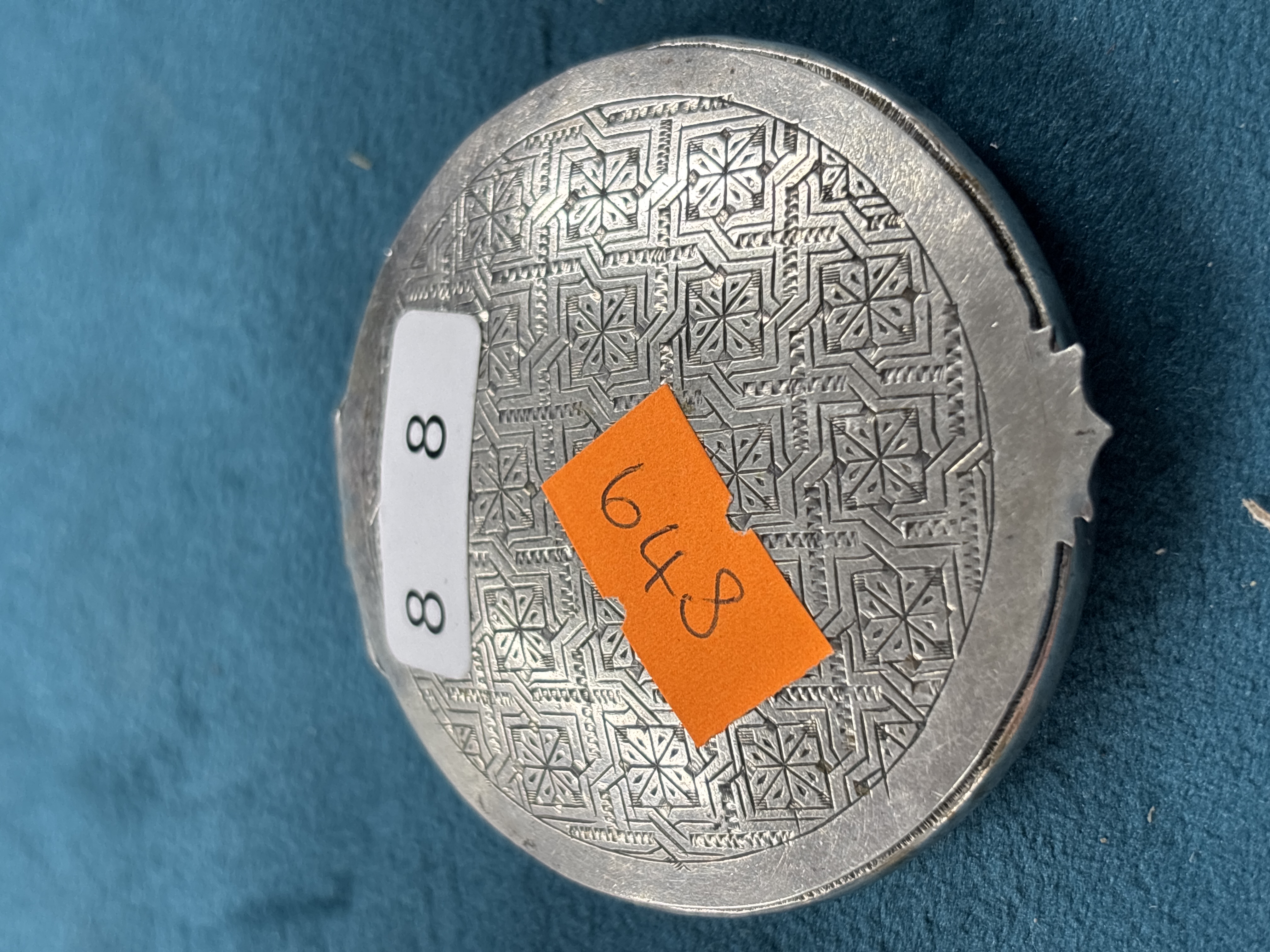 Lot 648 – An Engraved Silver-Toned Metal Circular Hinged Box – UAM ...